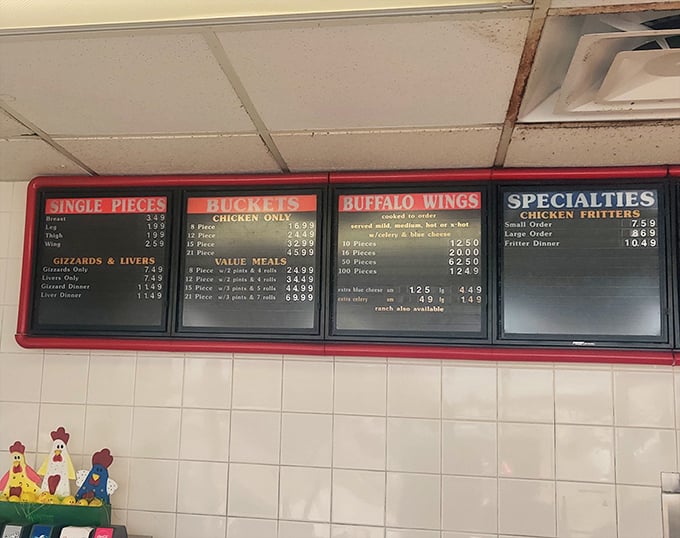 The menu board tells you everything you need to know about life's priorities: chicken first, sides second, and yes, they still serve gizzards for the true connoisseurs.