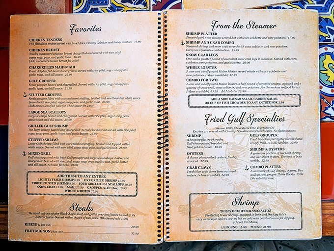A menu that reads like a love letter to the Gulf. Each page promises seafood nirvana that'll have you planning your next visit before the check arrives.