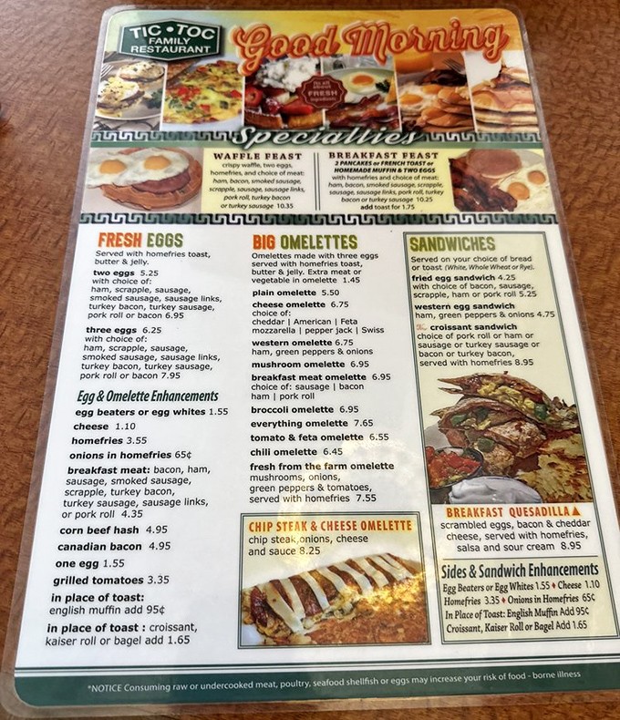 A breakfast menu that reads like poetry to the hungry soul. From "Waffle Feast" to "Everything Omelet," decisions here require serious contemplation and possibly a coin flip.
