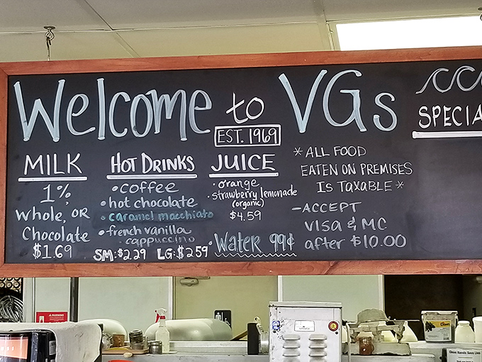 That chalkboard menu reads like a love letter to simplicity&mdash;no fancy fonts needed when your donuts speak volumes.