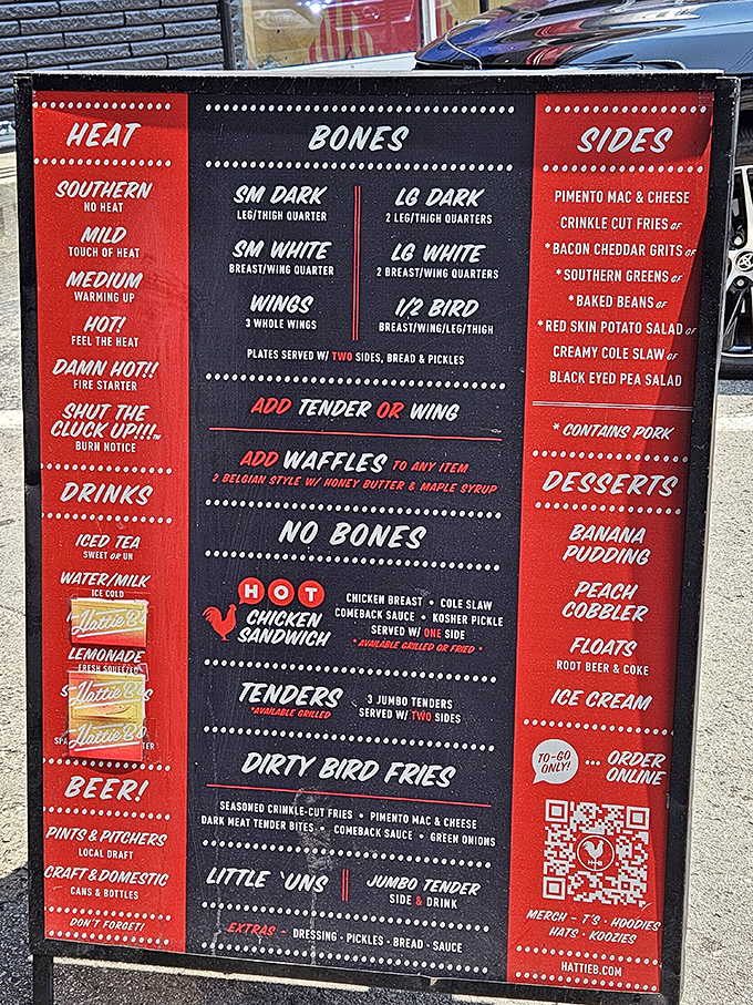 The menu board reads like a dare wrapped in Southern hospitality &ndash; choose your heat level wisely, friends.