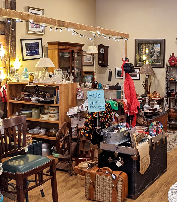 Every corner tells a story: vintage lamps illuminate treasures while string lights add whimsy. Grandmother's china might be hiding on those shelves!