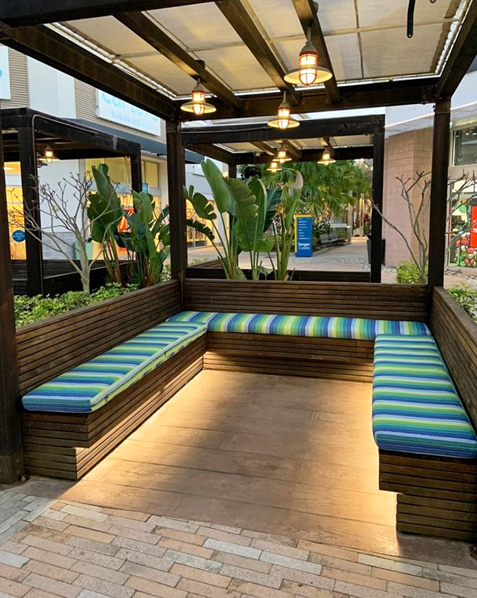 Covered seating areas with tropical touches &ndash; because even bargain hunters need their moment of zen.