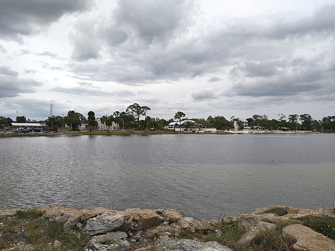 Gaze across St. Joseph Bay's tranquil waters where dramatic clouds create nature's own IMAX show, completely free of charge and concession stand prices.