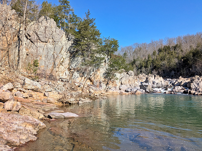The wooden boardwalk offers front-row seats to this geological masterpiece, where water and rock perform their eternal dance.