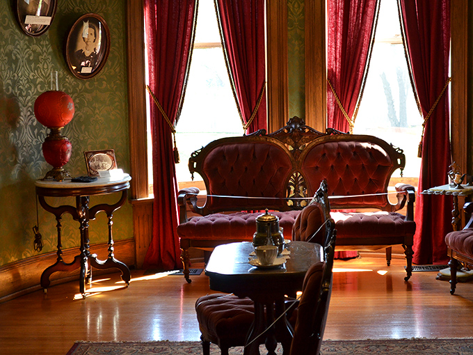 The parlor's crimson settee practically begs for gossip to be shared. Those velvet curtains have heard more secrets than a small-town barber.