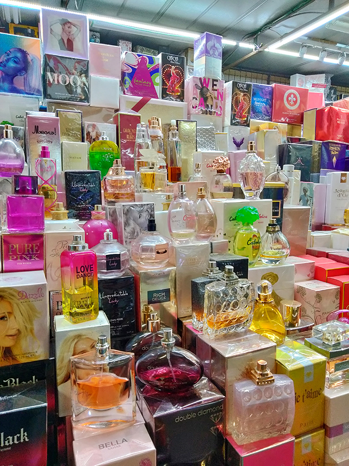 Perfume bottles create a fragrant mosaic of scents, where one spritz might transport you to Paris and the next to a tropical island getaway.