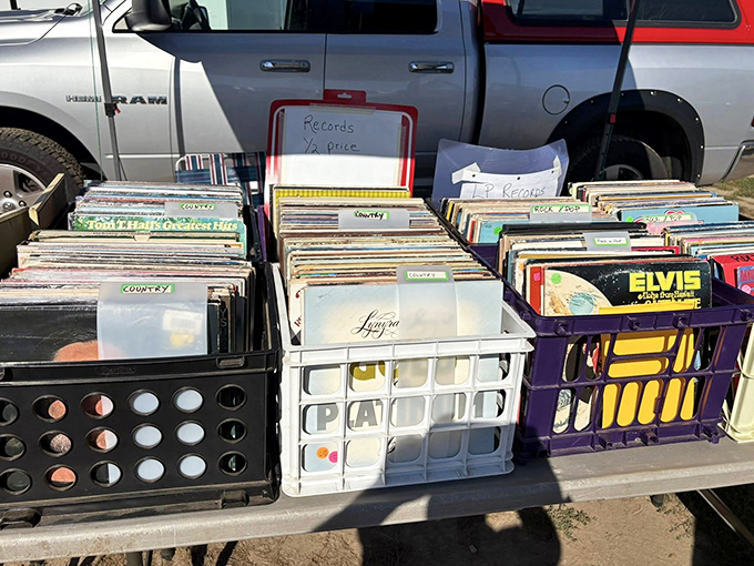Vinyl heaven spreads across truck tailgates, where Elvis might share space with your forgotten high school soundtrack.