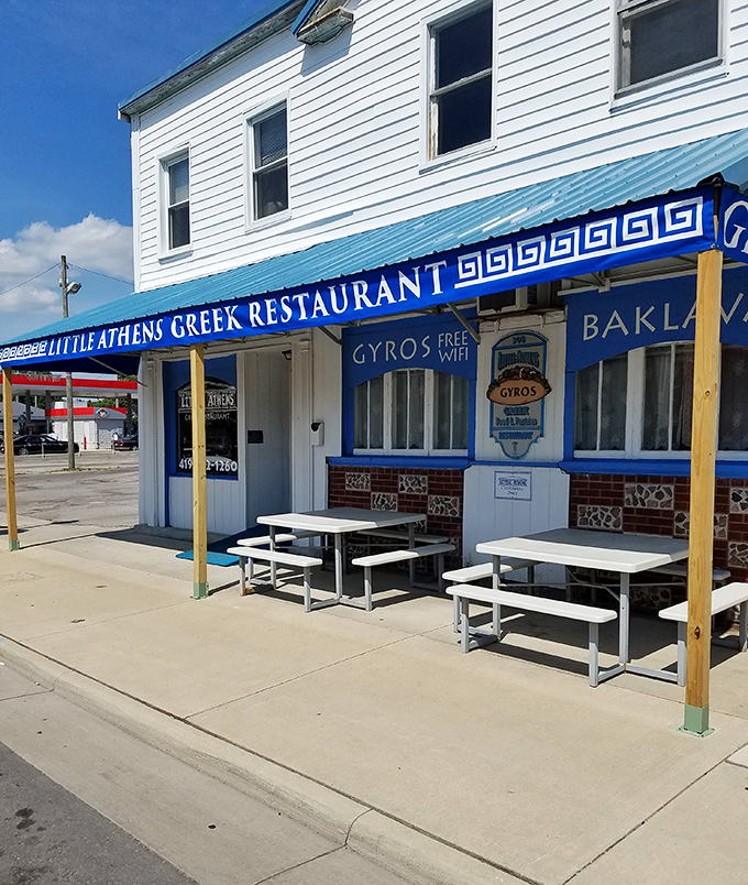 Little Athens Greek Restaurant brings Mediterranean flavors to the heartland with its vibrant blue awning promising gyros, baklava, and the modern necessity&mdash;free WiFi.