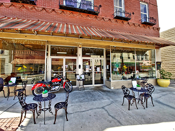 Nothing complements antiquing like a sidewalk café break. That vintage motorcycle parked outside is probably someone's pride and joy—or tomorrow's antique fair centerpiece.