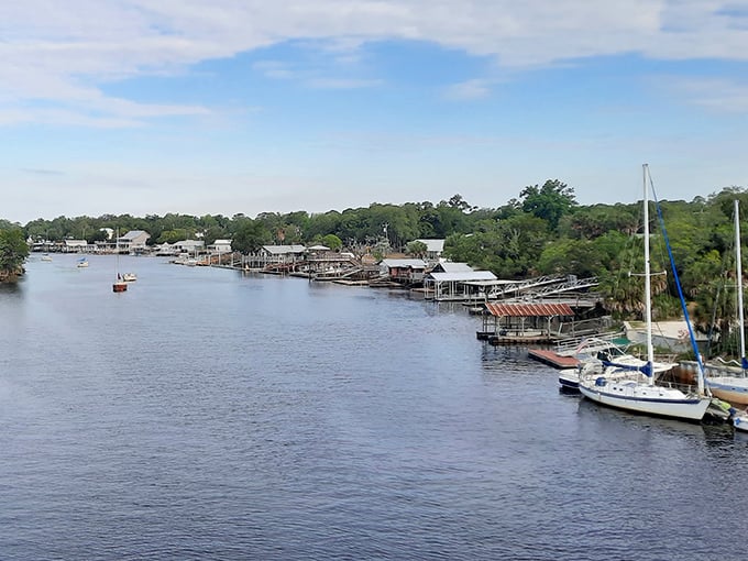 Sailboats and fishing vessels share the river like old friends who've agreed to peacefully coexist in paradise.
