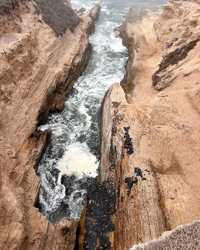 Nature's own Grand Canyon in miniature. The Pacific has carved this stunning channel with the patience only water can afford&mdash;one wave at a time.