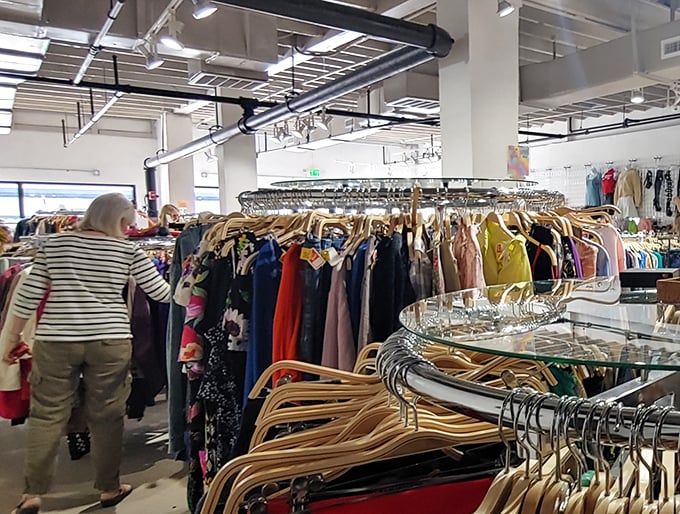 Treasure hunters navigate the well-organized racks where yesterday's splurges become today's affordable finds. The thrill of the hunt is real.
