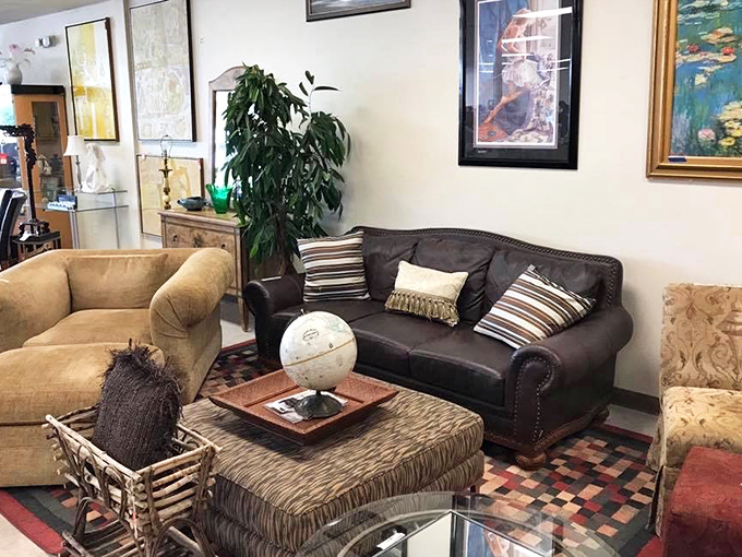 Living room vignettes that tell stories: this leather sofa has hosted conversations, the ottoman has supported tired feet, and that lamp has illuminated countless evenings. 