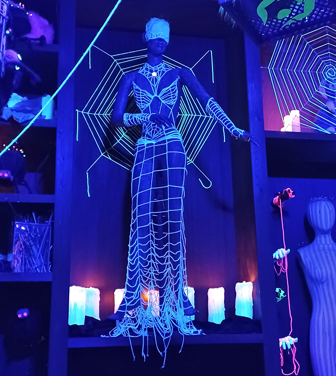 This luminous spider-woman installation proves that even arachnophobia can be beautiful when bathed in neon and imagination.