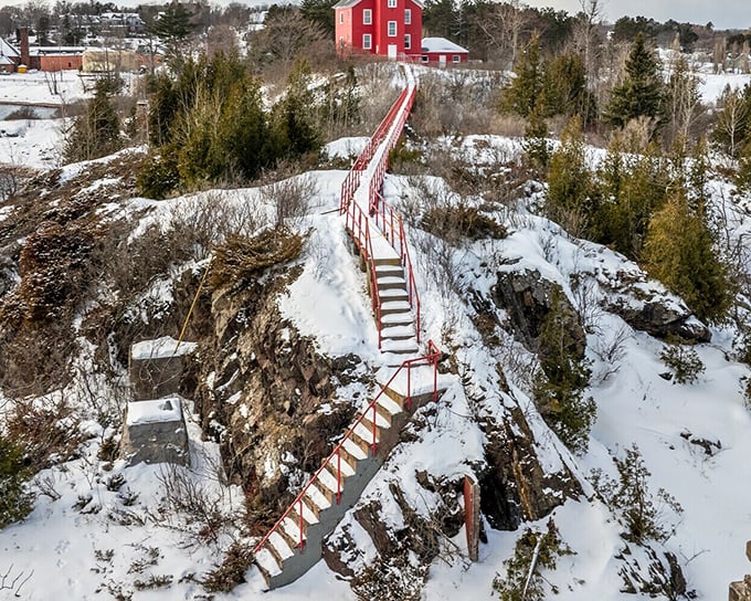 These iconic red stairs climb dramatically through winter's embrace, leading adventurous souls to breathtaking views and the promise of discovery.
