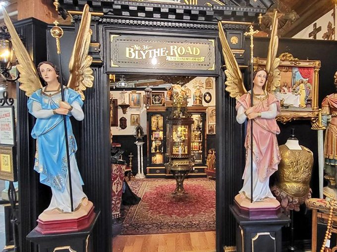 Angels guarding the gateway to "Blythe Road," where religious artifacts meet Hollywood glamour in a perfectly staged vignette of nostalgic opulence.