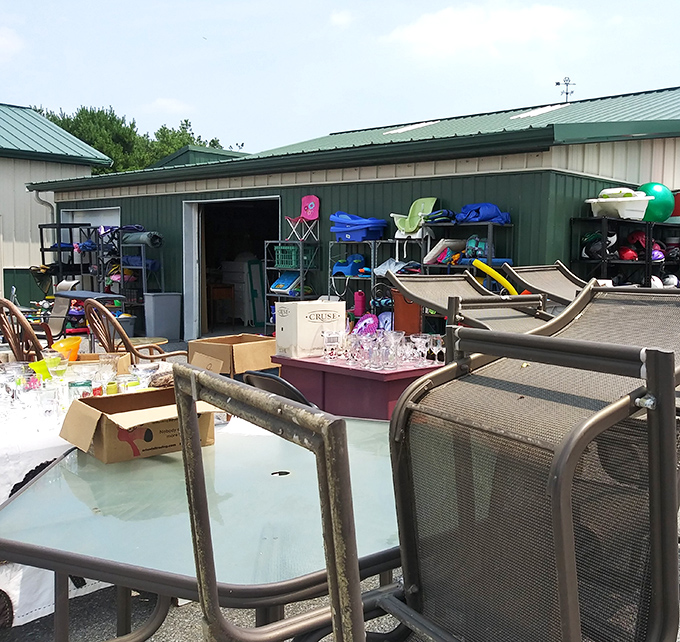 The outdoor warehouse area feels like a garage sale hosted by the universe&mdash;patio furniture, toys, and mysteries waiting to be discovered.