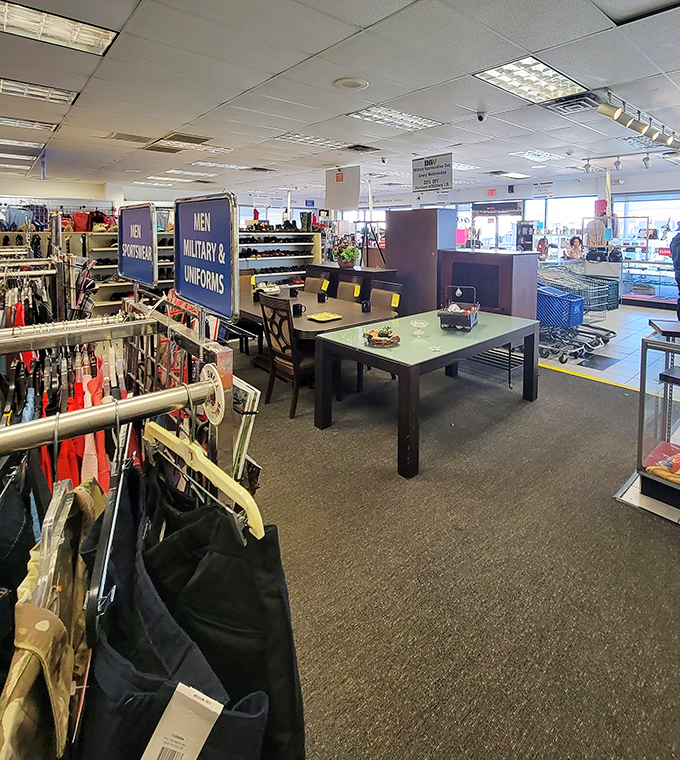 Military uniforms stand at attention alongside dining furniture—a uniquely American retail salute that combines service and domesticity.