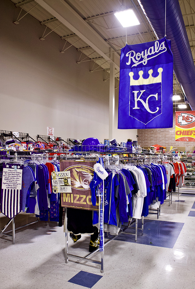 Kansas City pride on full display! The sports section is a sea of Royals blue, Chiefs red, and Mizzou gold for the thrifty fan.