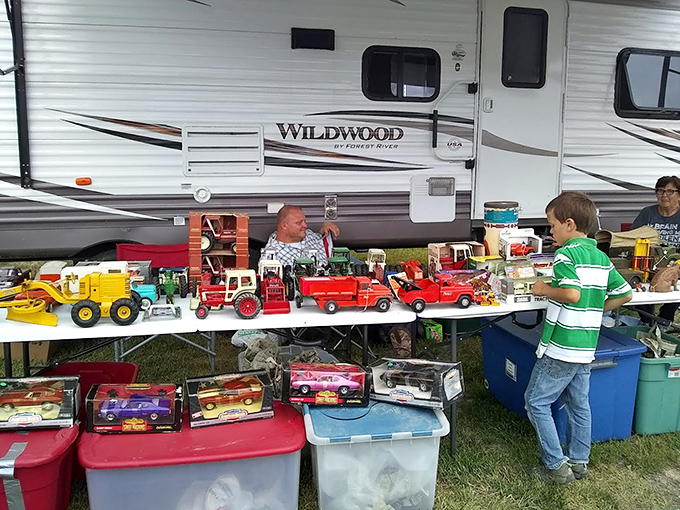 Childhood nostalgia parked in neat rows. This vendor's vintage toy truck collection has grown men reminiscing about the Christmas mornings when these beauties first appeared under the tree.
