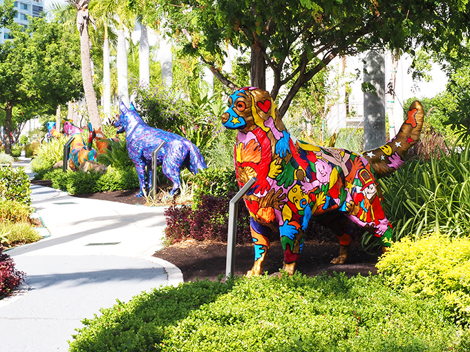 A rainbow explosion of canine creativity. These vibrant sculptures transform an ordinary walkway into a tail-wagging wonderland.