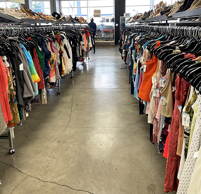 The rainbow road of secondhand fashion stretches before you, each hanger holding someone's past and possibly your future statement piece.