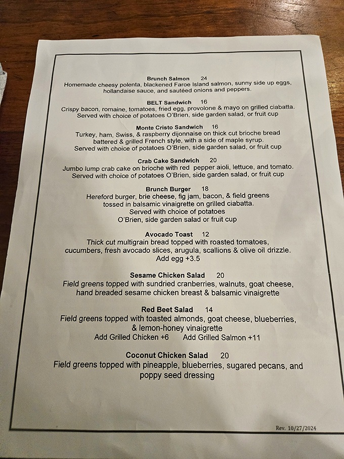 A menu that reads like a love letter to brunch enthusiasts. The coconut chicken salad sits there innocently, not revealing its cult-like following. 