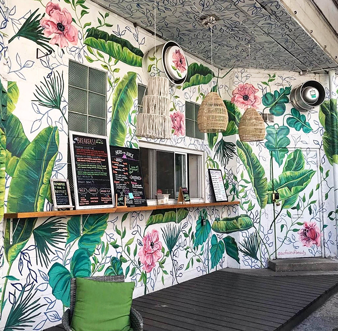 Tropical murals transport you somewhere magical - where donuts bloom like edible flowers on every wall.