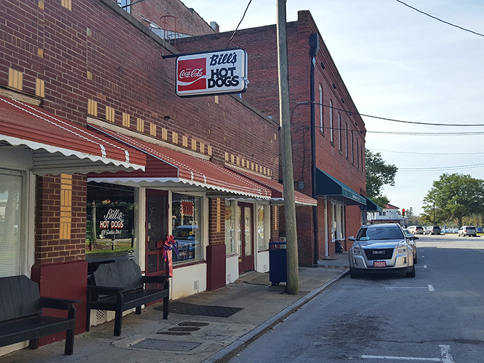 Bill's Hot Dogs' unassuming brick facade hides a temple of hot dog perfection. That Coca-Cola sign has been calling to hungry travelers for generations.