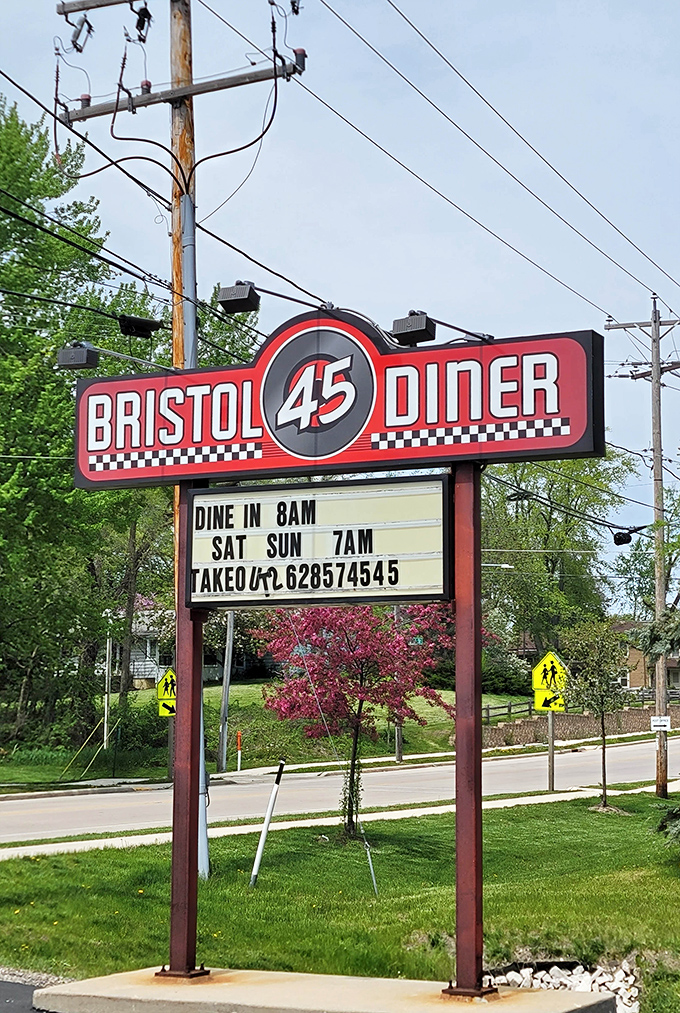 Bristol 45 Diner's sign stands tall against the Wisconsin sky. The checkered racing theme promises food that'll get your motor running.