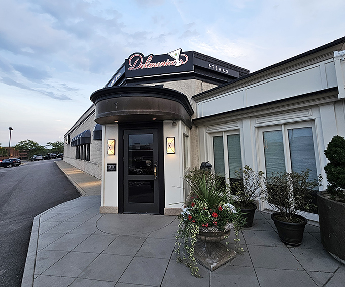 Delmonico's curved entrance and elegant stonework set the stage for a meal that's equally well-crafted. Steak as architecture, both inside and out.