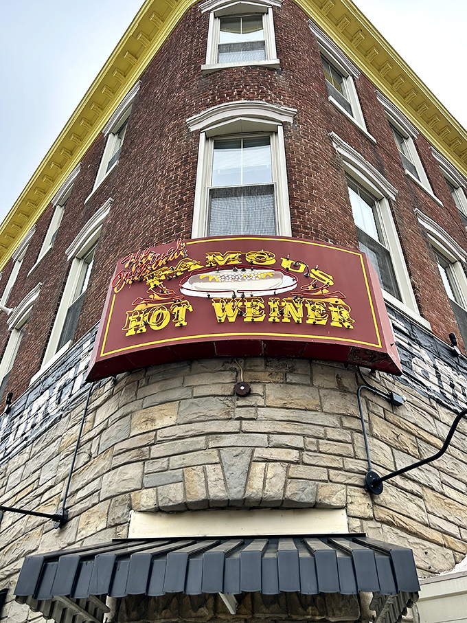That giant hot dog sign isn't just advertising; it's a beacon calling all frankfurter faithful home.