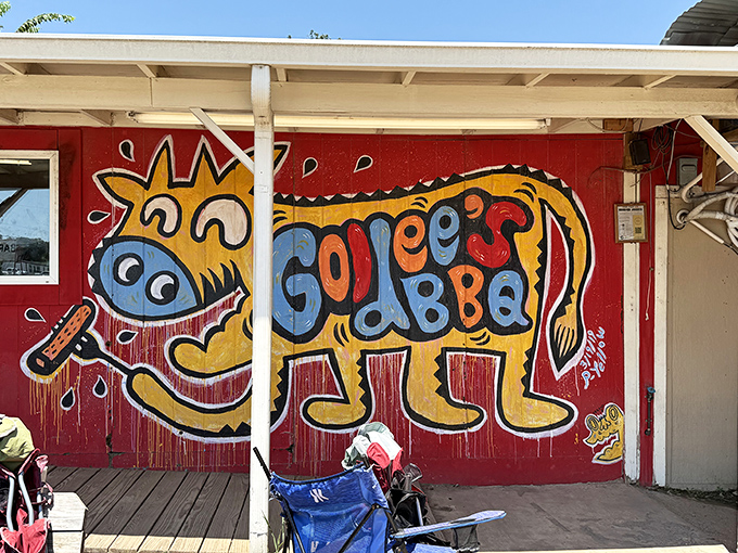 Goldee's colorful pig mural practically winks at you, promising barbecue adventures that'll make your taste buds dance.
