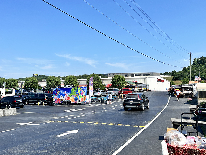 Great Smokies Flea Market's exterior - where cars gather like pilgrims at a shrine dedicated to the holy trinity of bargains, oddities, and nostalgia.