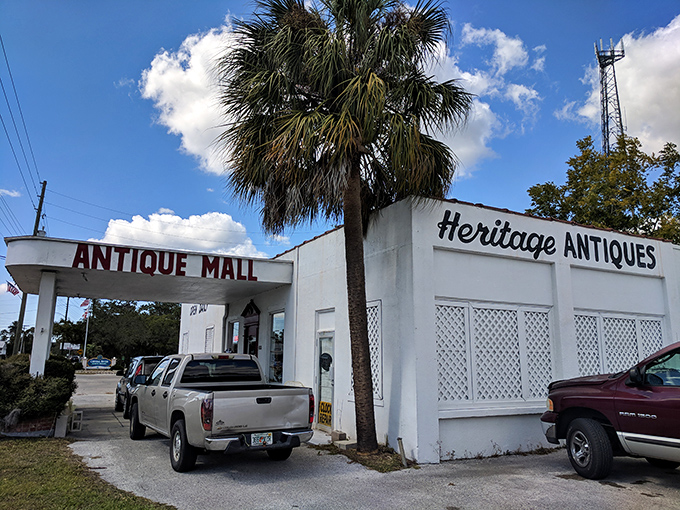 Heritage Antiques Mall's classic white facade whispers stories of Florida's past waiting patiently to be rediscovered inside.