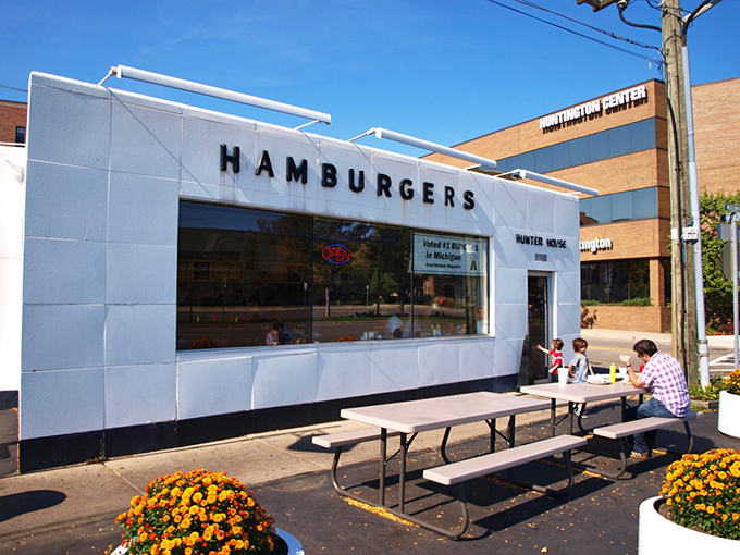 That pristine white exterior whispers promises of perfectly steamed buns and crispy-edged patties within.