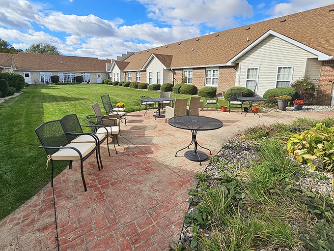 Brick pathways wind through gardens where retirement dreams take root and Social Security checks actually cover the bills.