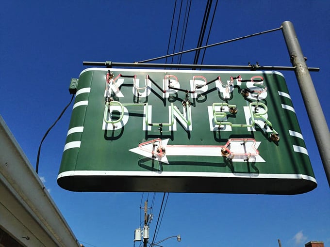 Kuppy's vintage green sign with that confident arrow points the way to small-town diner perfection. Follow it for hash brown heaven!