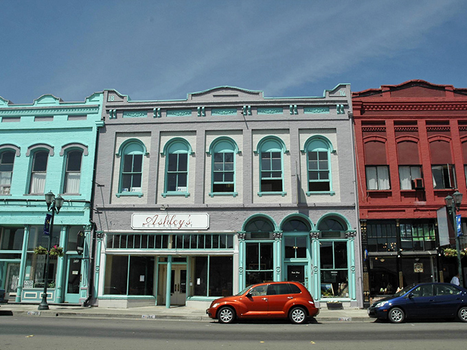 Pastel paradise! Lakeport's candy-colored Victorian buildings stand shoulder-to-shoulder like fashionable ladies at a garden party, complete with a sassy red PT Cruiser.