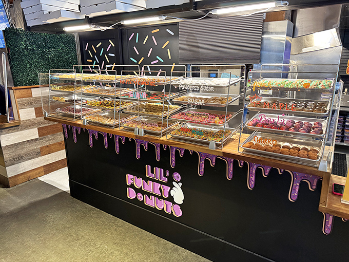 Lil' Funky Donuts lives up to its name with a display case that's a rainbow of sweet possibilities. The dripping pink design on the counter adds just the right amount of whimsy.
