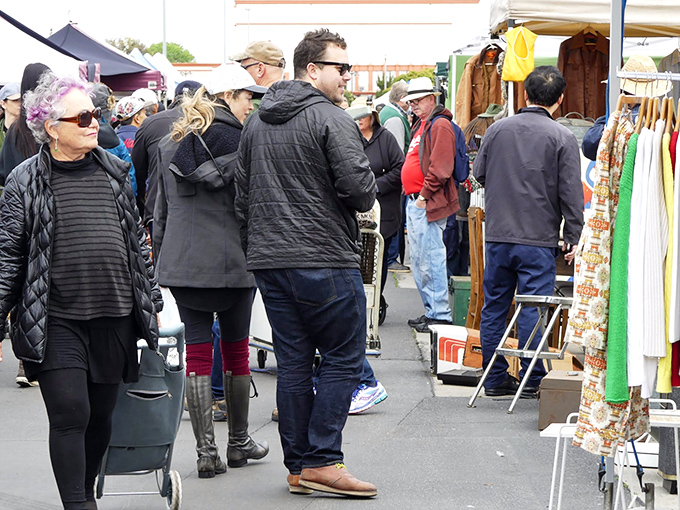 Shoppers weave through the bustling Long Beach Antique Market, where yesterday's treasures await their second chance at stardom.