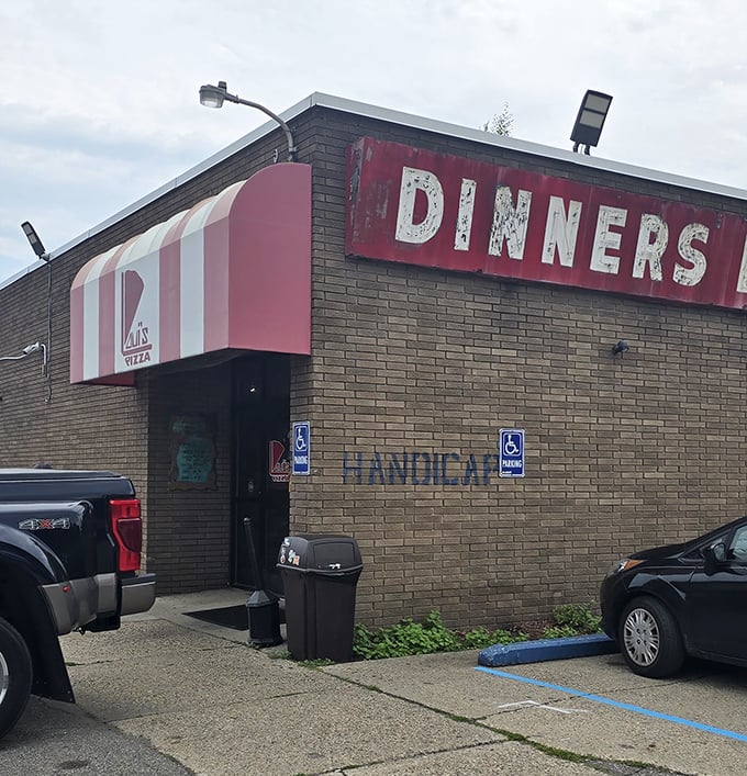 Loui's brick facade whispers decades of Detroit pizza perfection - some legends never need flashy signs.