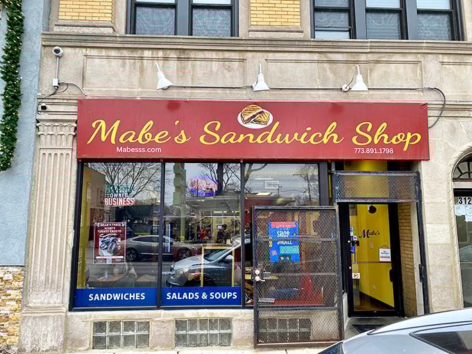 Mabe's bright red sign beckons sandwich lovers like a lighthouse guiding hungry ships to delicious shores.