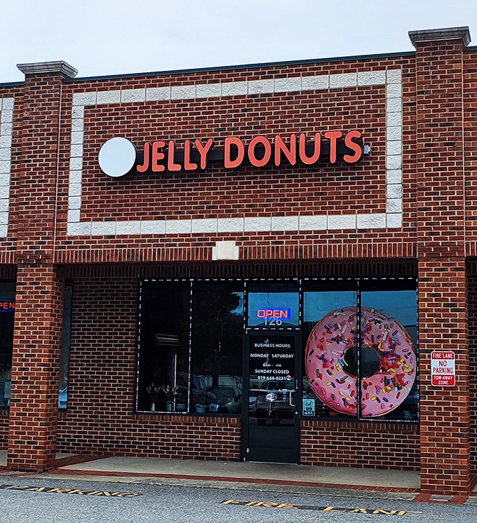 Bold red letters announce serious donut business - the kind of place that delivers exactly what it promises.