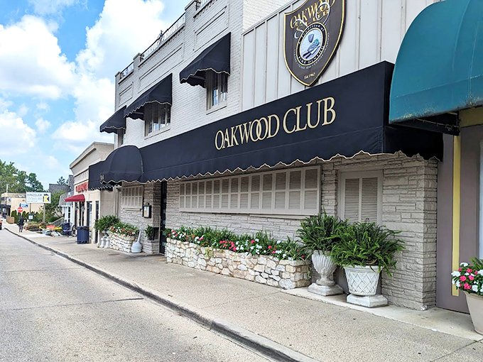 The Oakwood Club's elegant fa&ccedil;ade whispers "special occasion" while the neon sign winks "come as you are."