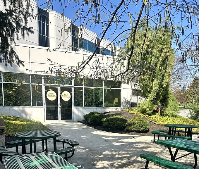 Picnic tables outside hint at the casual vibe. This unexpected office park gem serves up sandwiches that make corporate lunches anything but boring.