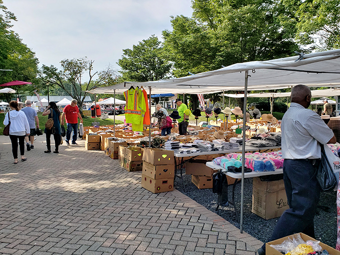 Road signs point to nostalgia while vendors create colorful pathways through this outdoor shopping adventure.