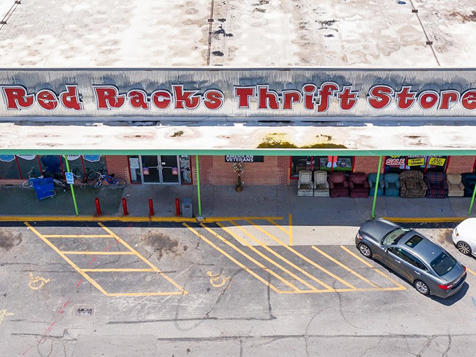 Red Racks' cheerful green awning beckons bargain hunters like a beacon of hope for budget-conscious shoppers.