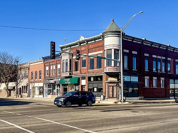 Brick storefronts line up like old friends, each one holding decades of neighborhood memories.